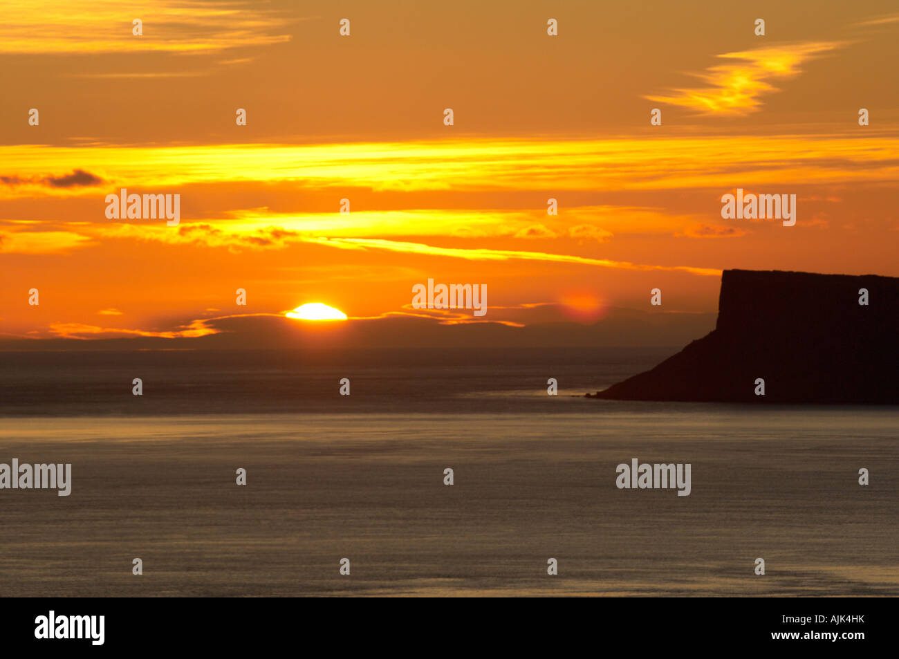 Sun rising over Fairhead Co Antrim Northern Ireland Stock Photo - Alamy