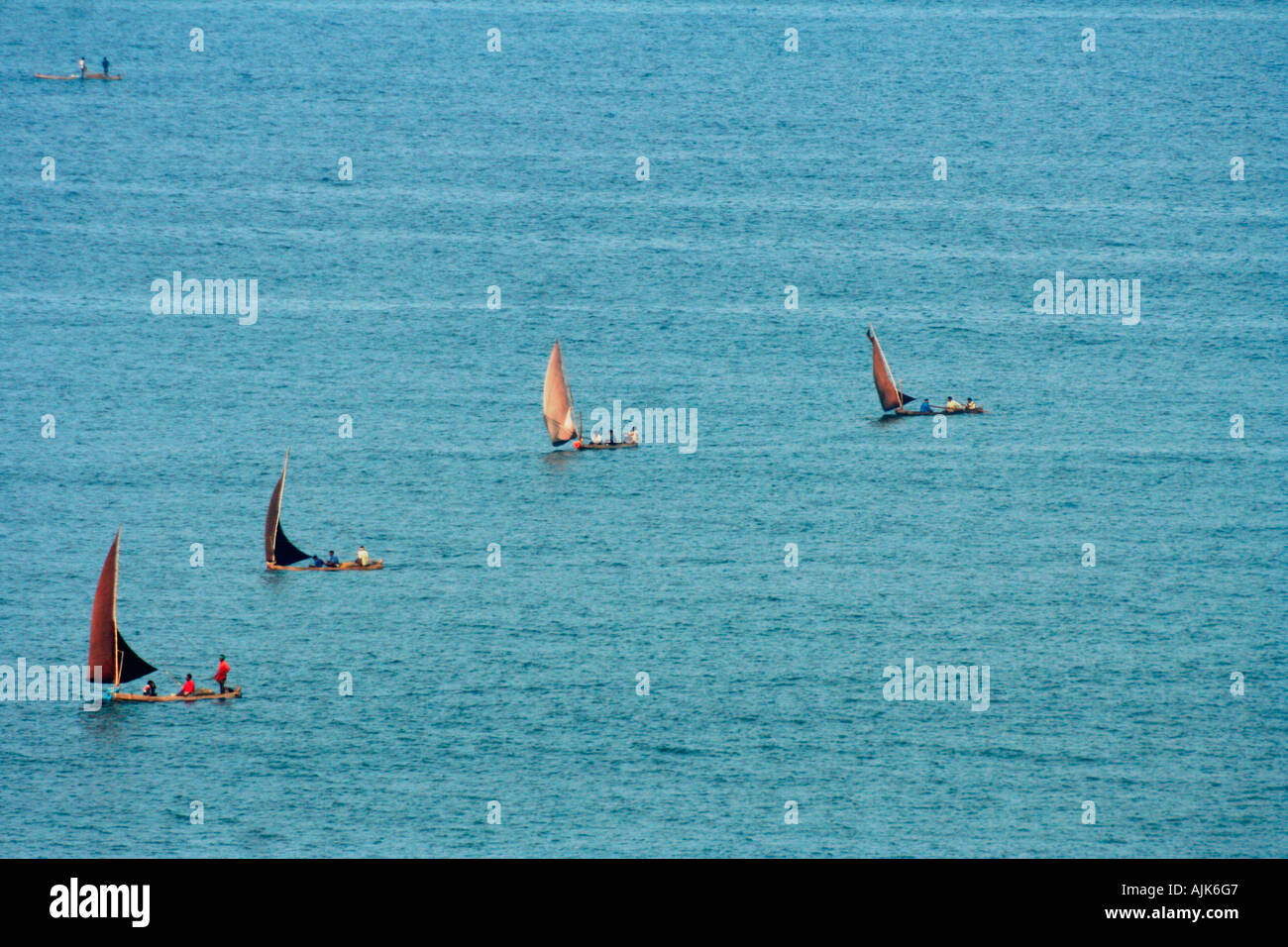 A row of boats setting sail from Vizhinjam beach, Kerala, India Stock ...