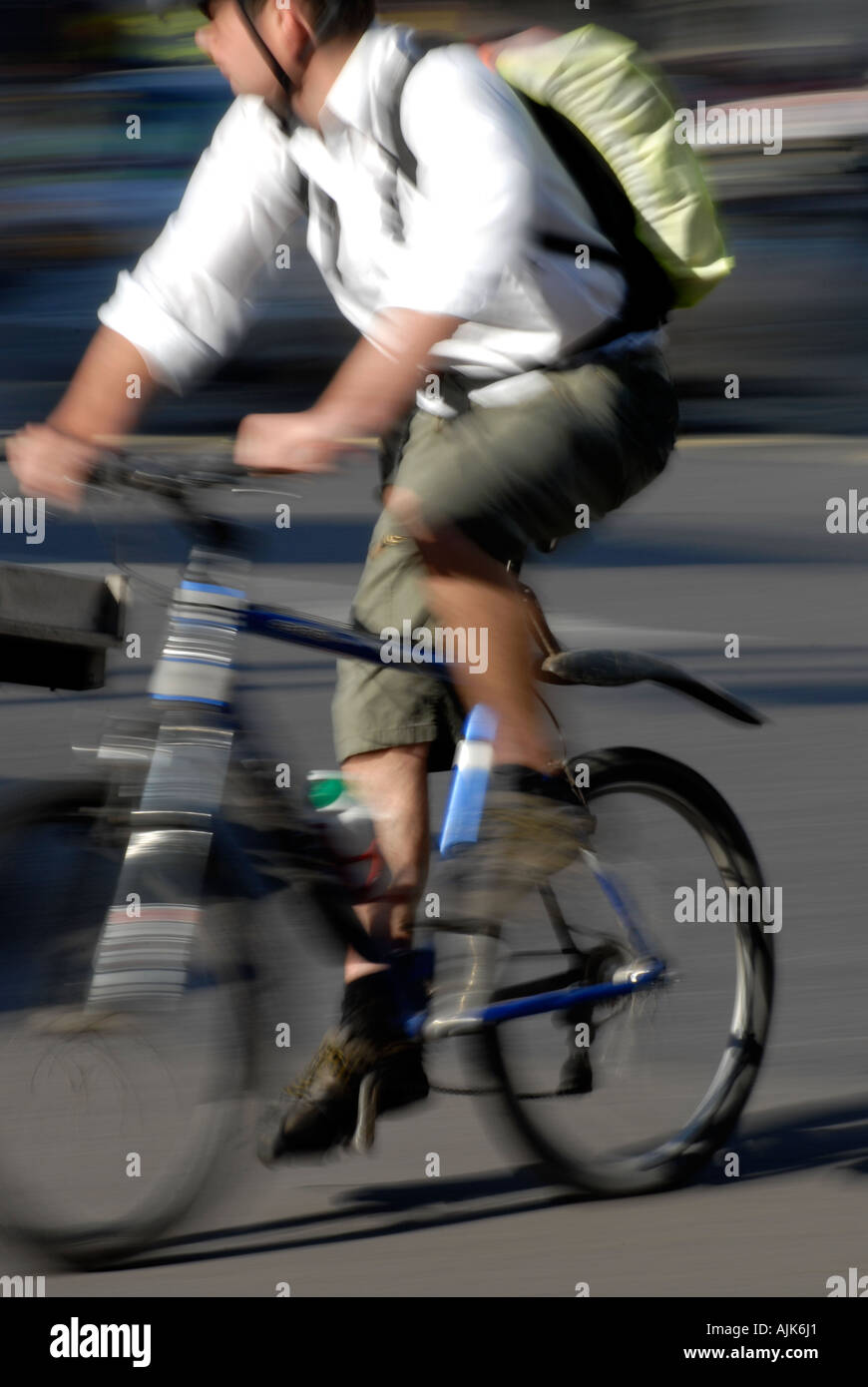 Cyclist in the rush hour in the City of London Stock Photo - Alamy