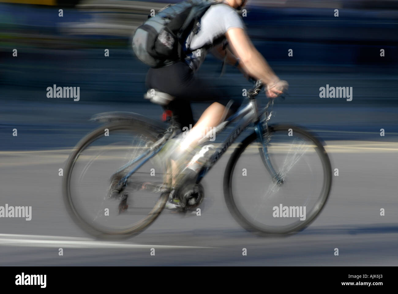 Cyclist in the rush hour in the City of London Stock Photo - Alamy