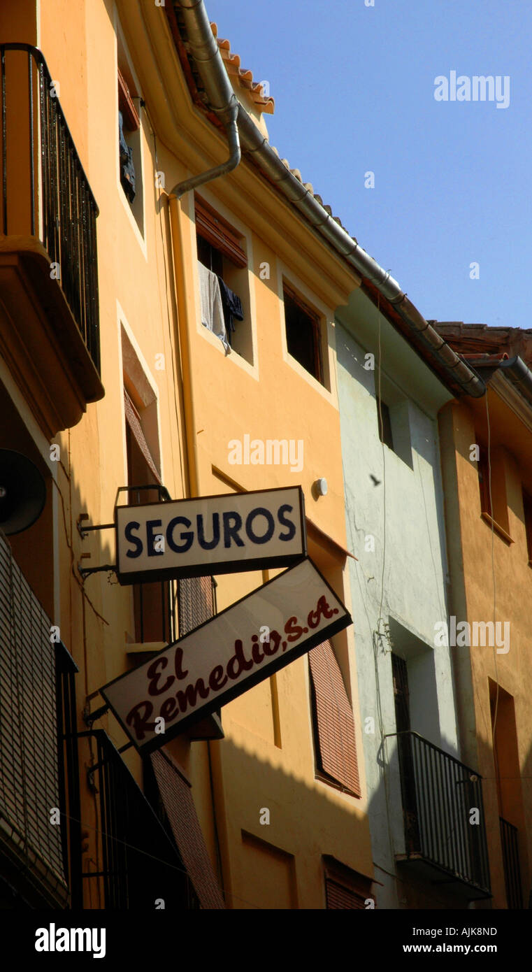 spanish shop signs in pastel colored side street in the historic town ...