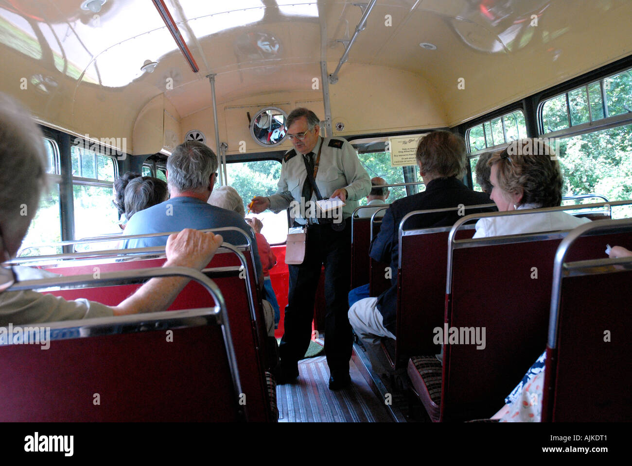 Passengers and conductor on a restored 1959 Leyland Tiger Cub King ...