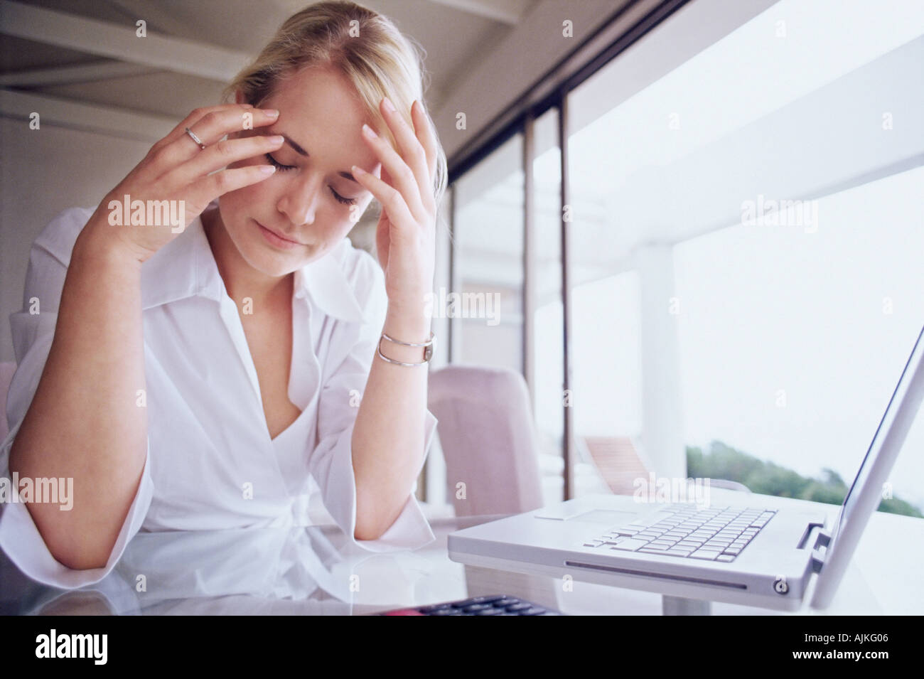 Woman looking stressed Stock Photo - Alamy