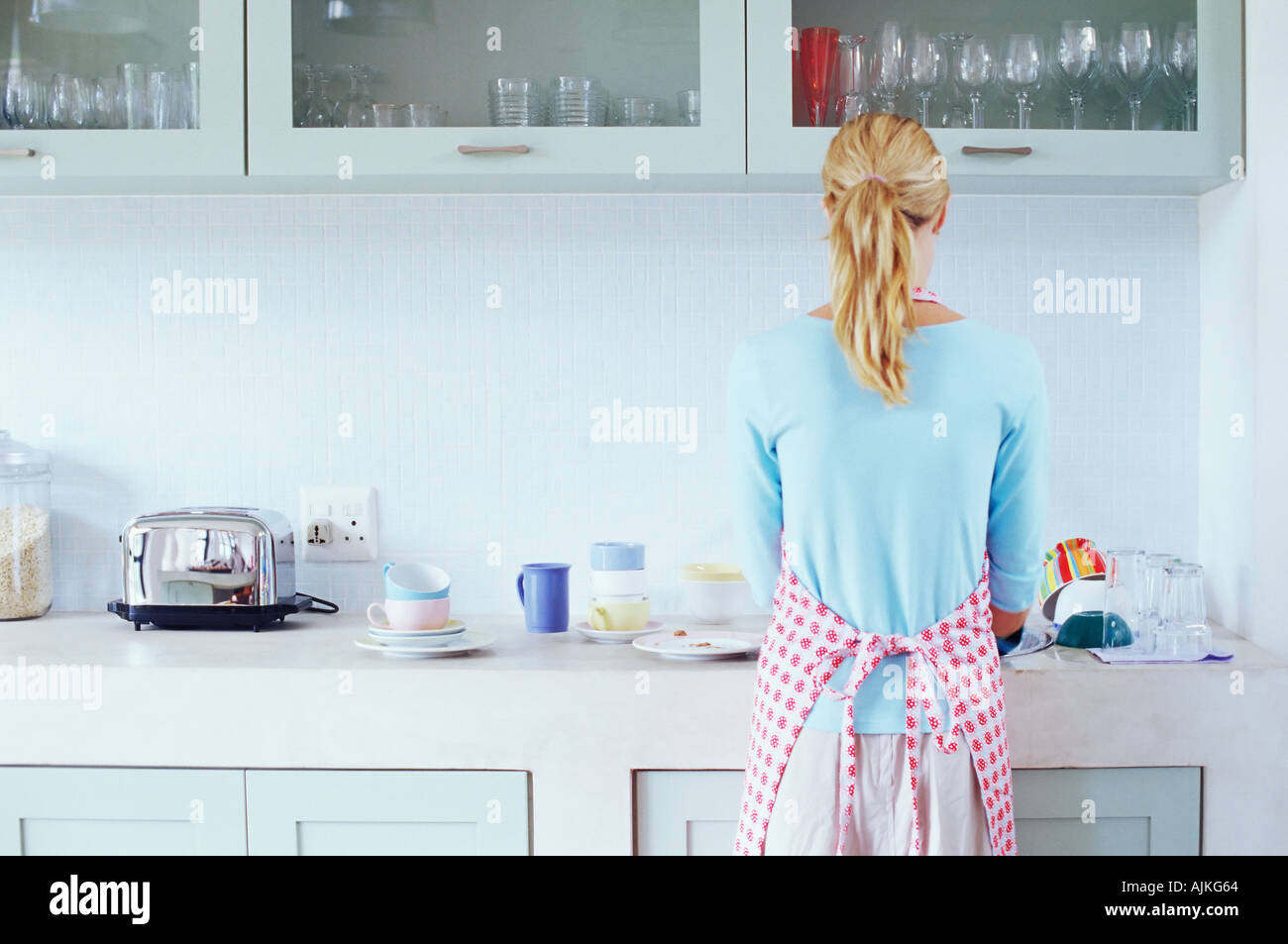 Woman washing up Stock Photo - Alamy