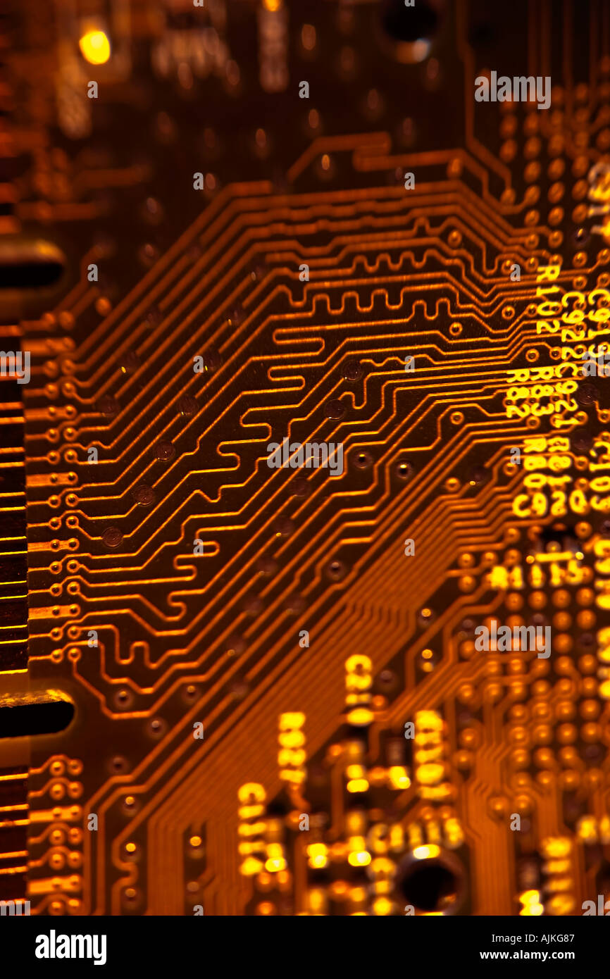 Circuit Board traces in orange Stock Photo - Alamy