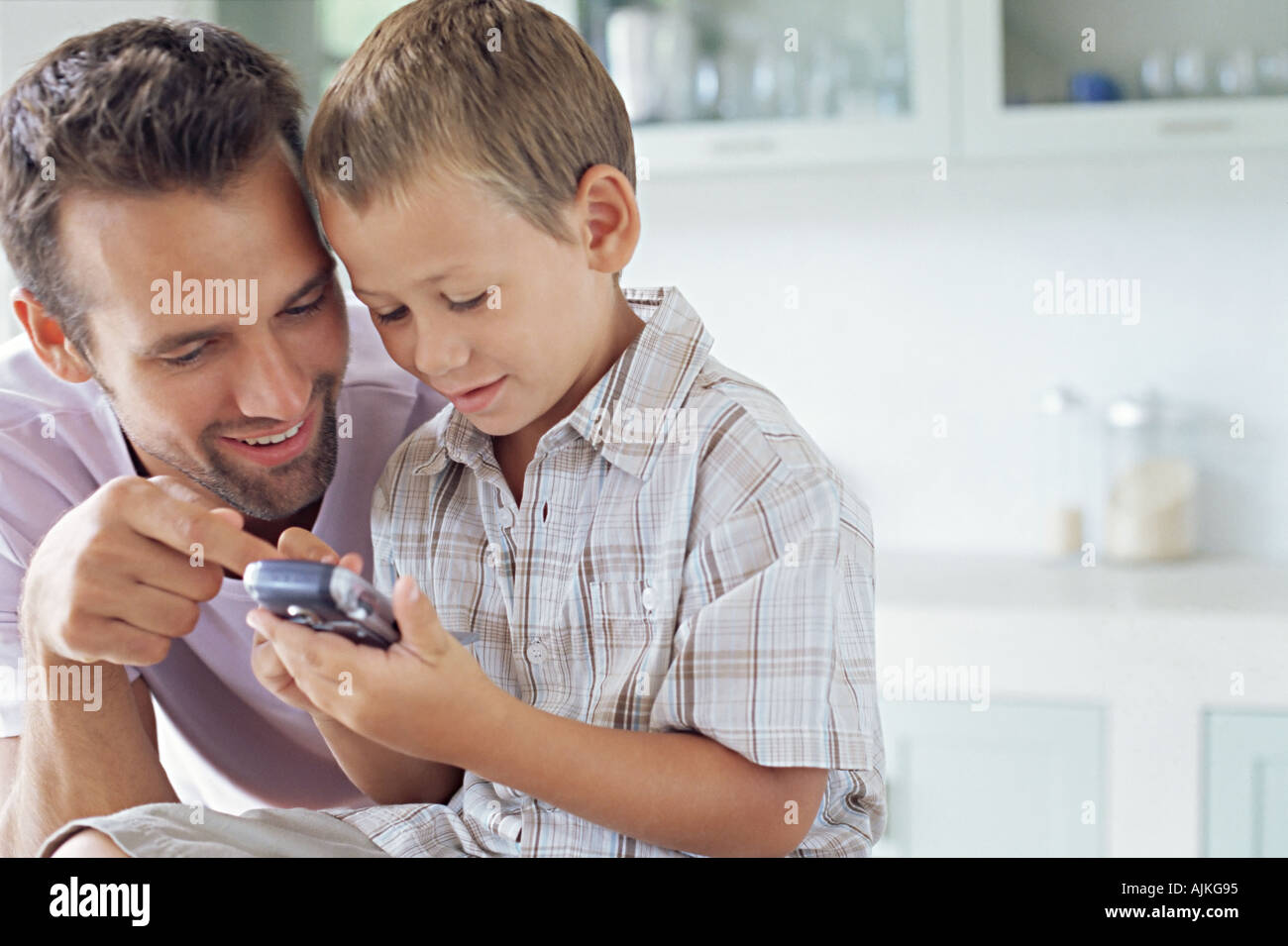 Father Son Mobile Phone High Resolution Stock Photography and Images ...