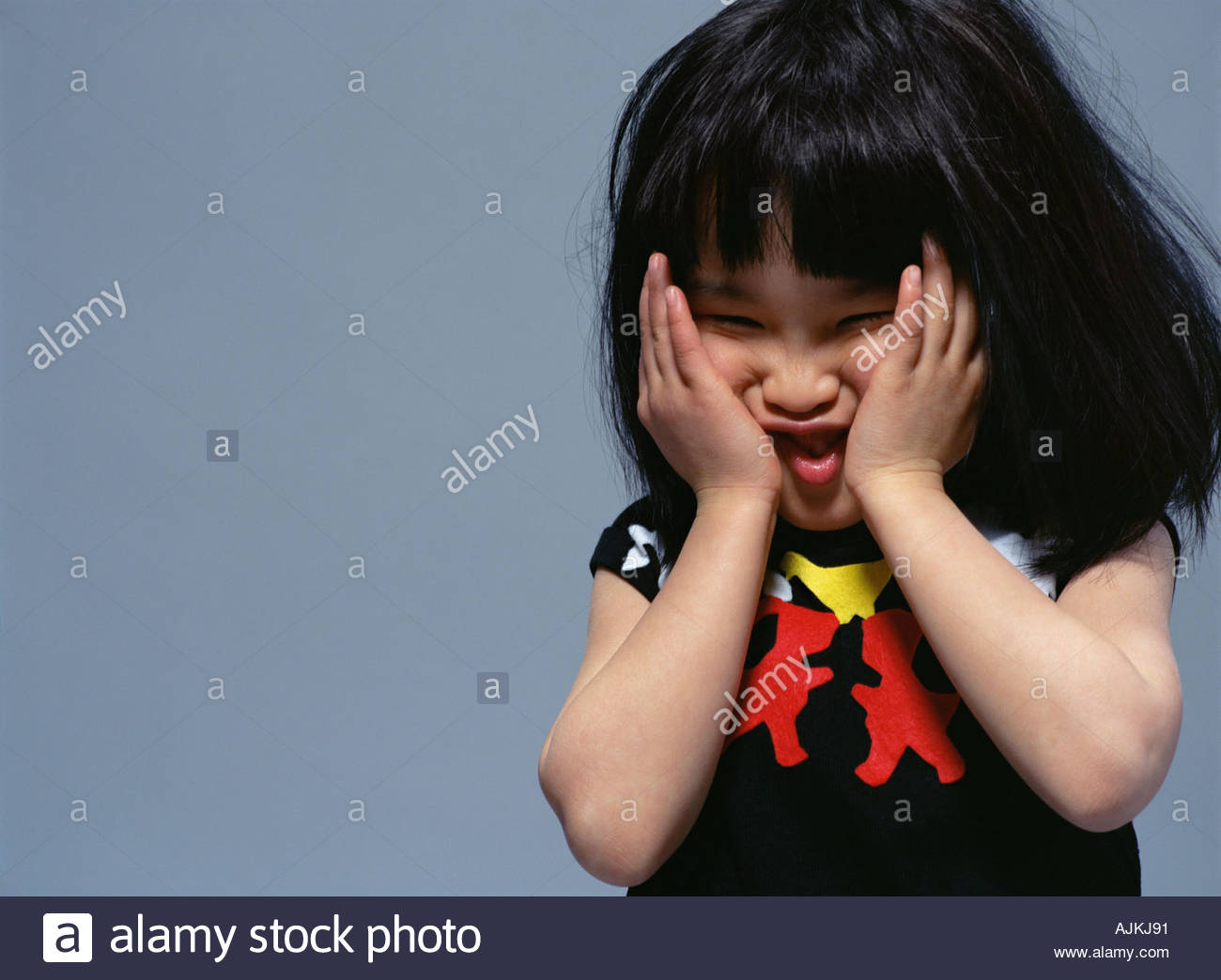 Squeezing Cheeks Stock Photos & Squeezing Cheeks Stock Images - Alamy