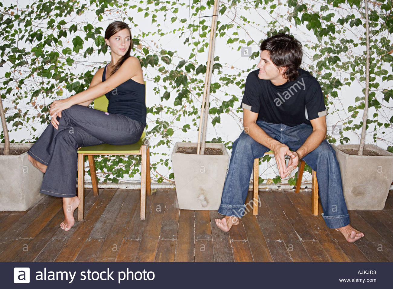 Romantic Couple Sitting On Chair Stock Photos & Romantic Couple Sitting ...