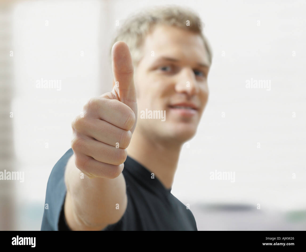 Man giving thumbs up Stock Photo - Alamy