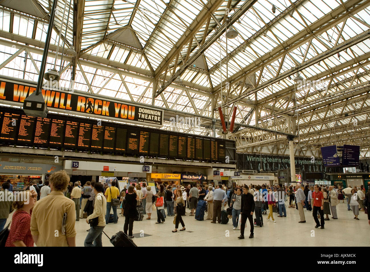 Crowds of people around the departure/ arrival board at Waterloo train ...