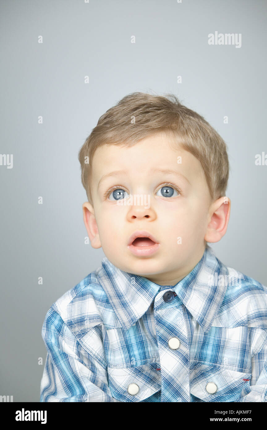 Shocked looking boy Stock Photo - Alamy