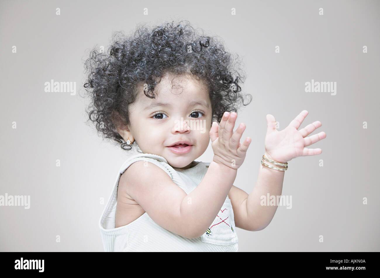 Baby girl clapping Stock Photo - Alamy