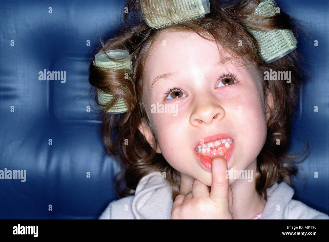 Girl showing two new teeth Stock Photo - Alamy