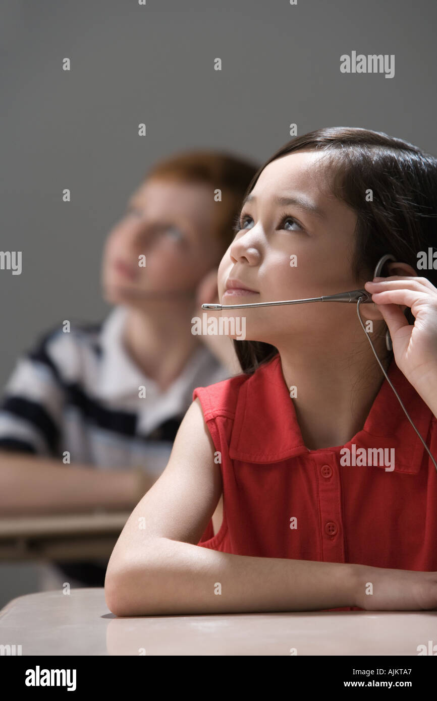 School children wearing headsets Stock Photo - Alamy