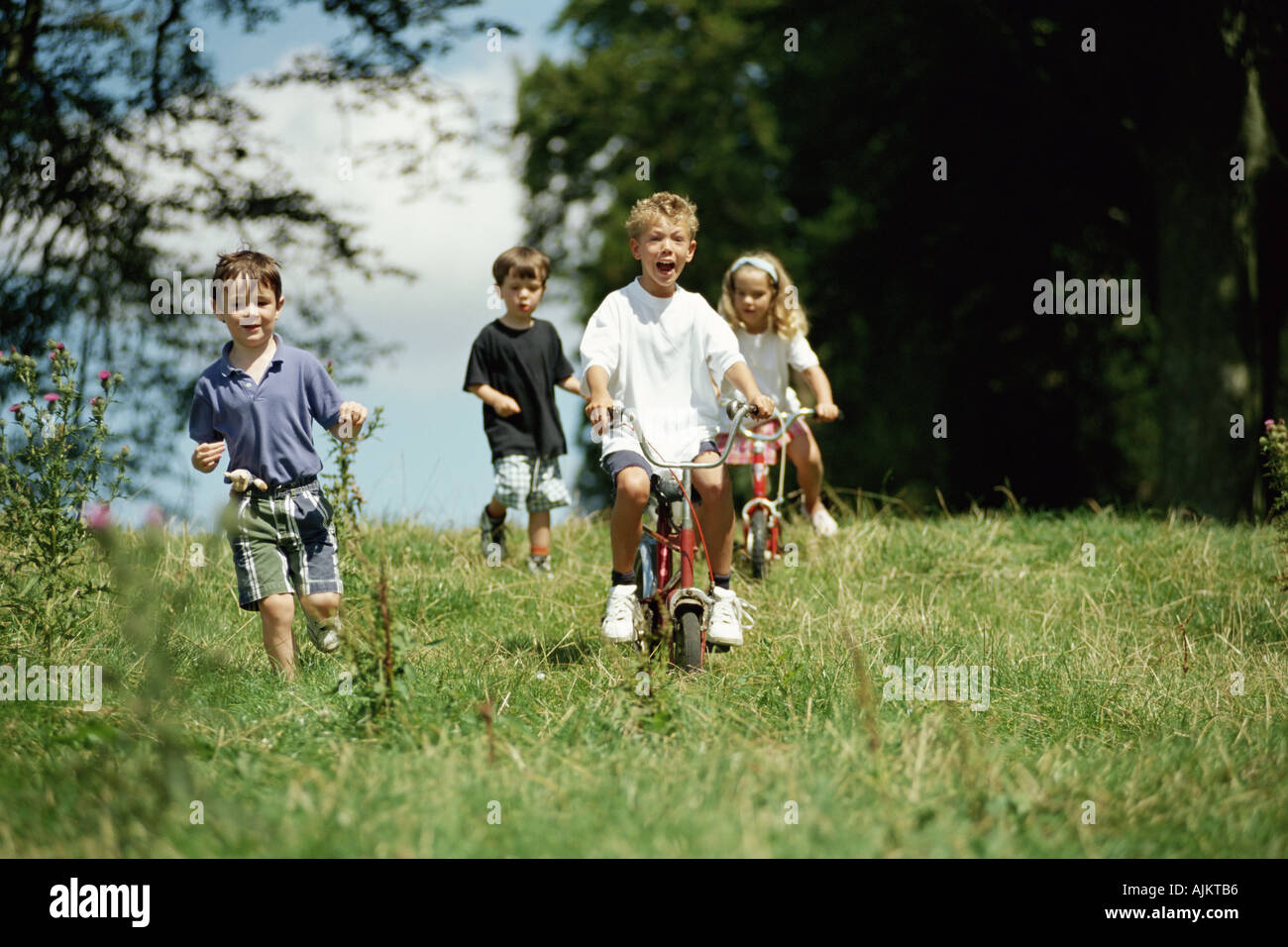 Children riding bikes hi-res stock photography and images - Alamy