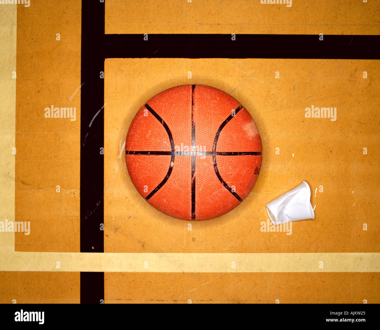 Basketball on court Stock Photo - Alamy