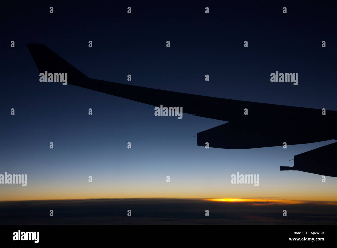 Aircraft wing taken at sunset at a graphic angle Stock Photo - Alamy