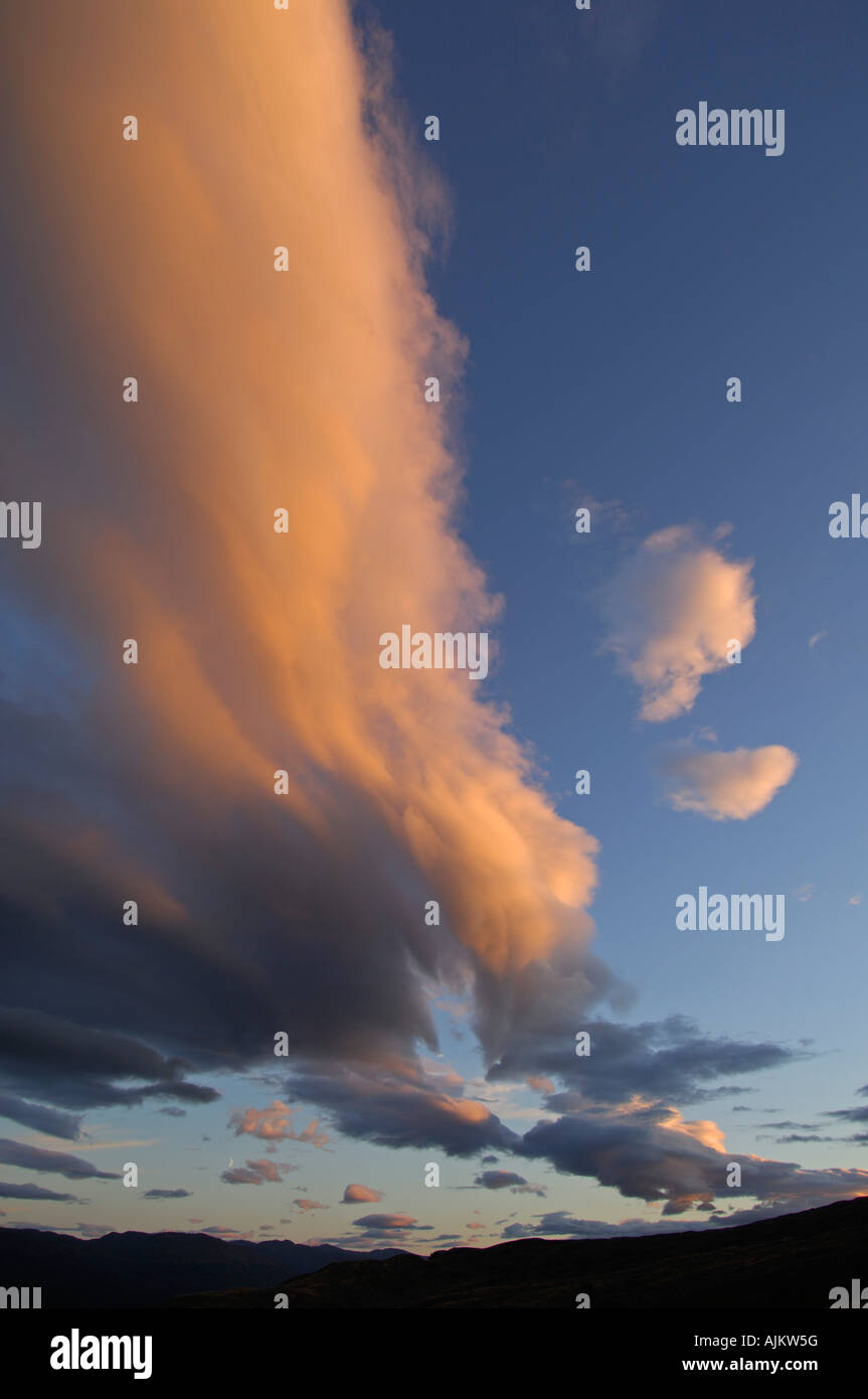 Big sky over Strath Tay with sweeping cloud formations lit by low warm ...