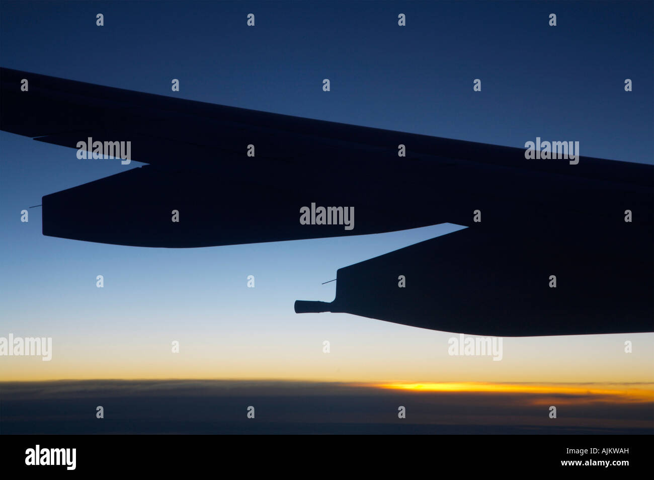 Aircraft wing taken at sunset at a graphic angle Stock Photo - Alamy