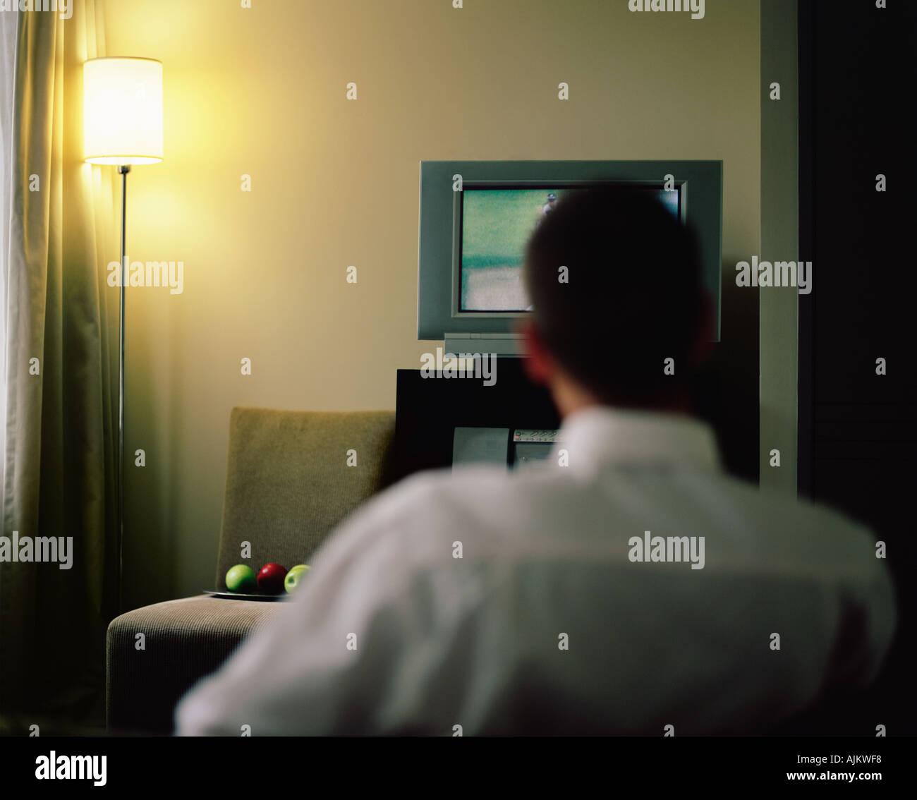 Man watching television Stock Photo - Alamy