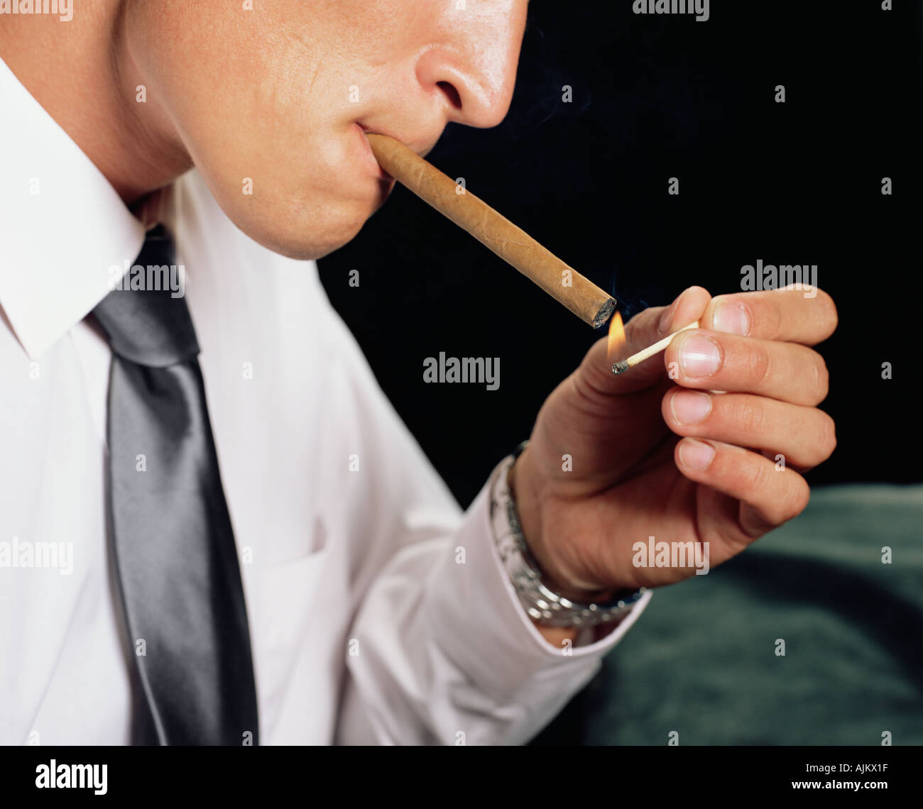 Man lighting cigar hi-res stock photography and images - Alamy