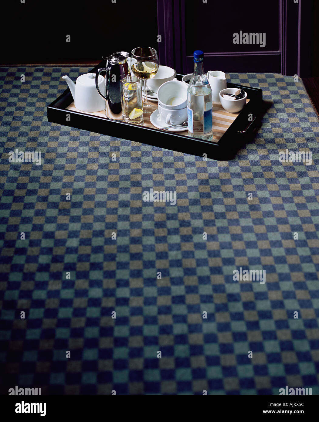 Tray on hotel carpet Stock Photo - Alamy