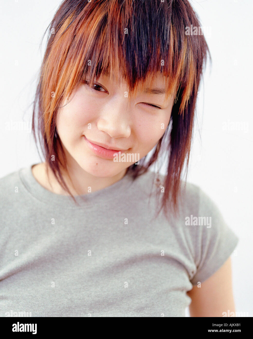 Close up woman winking eye hi-res stock photography and images - Alamy