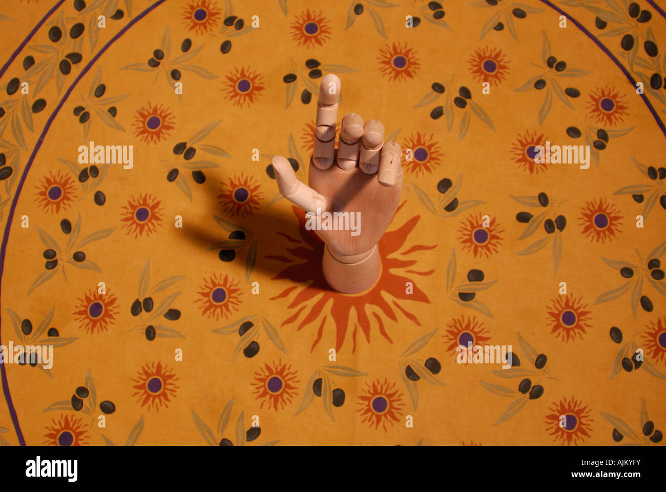 Wooden hand in table centre Stock Photo - Alamy