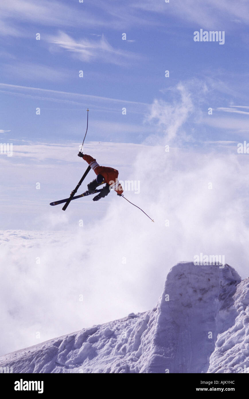 A man about to crash while skiing on a quarter pipe jump at Mount Hood ...