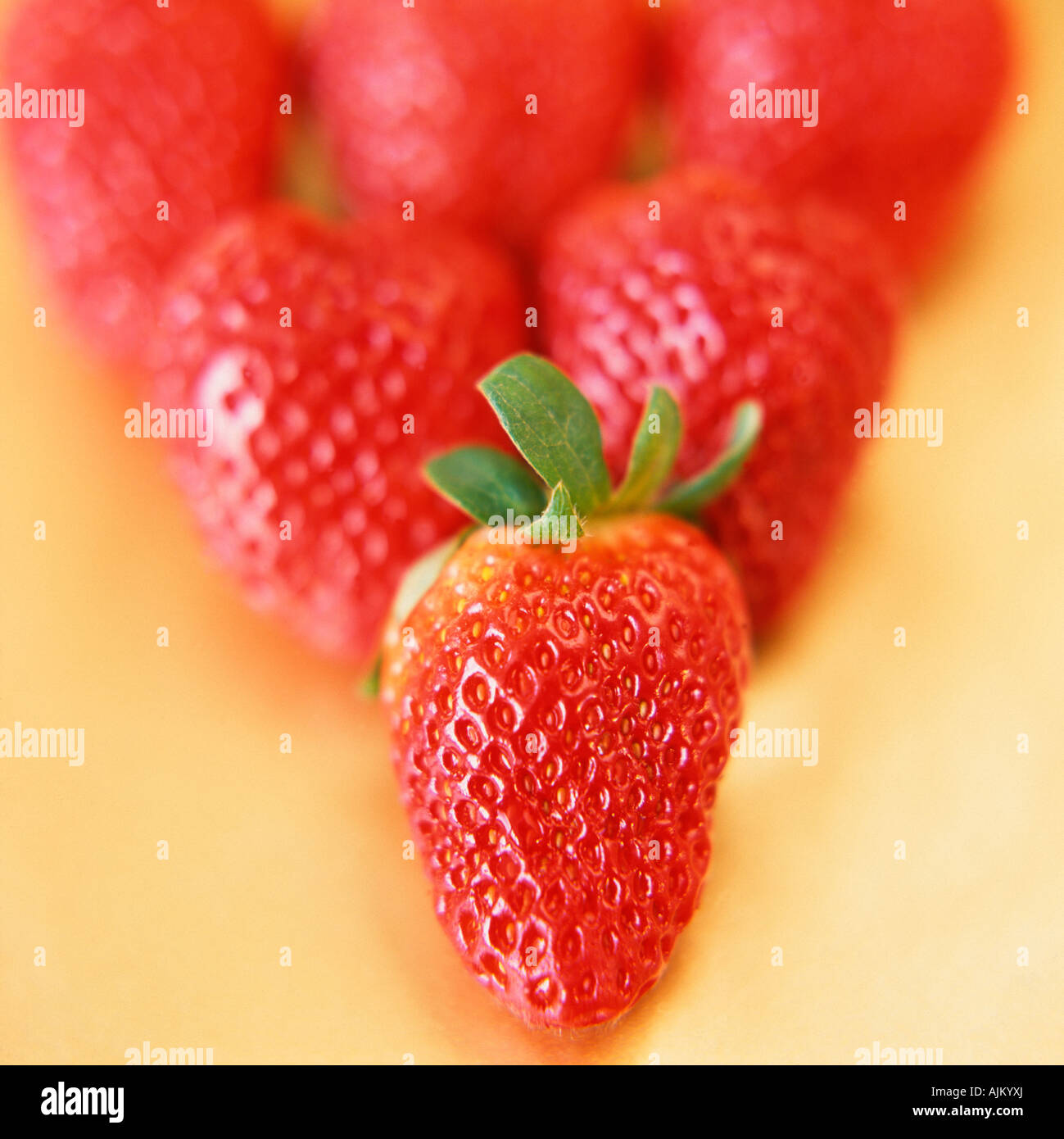 Strawberries in a triangle shape Stock Photo - Alamy