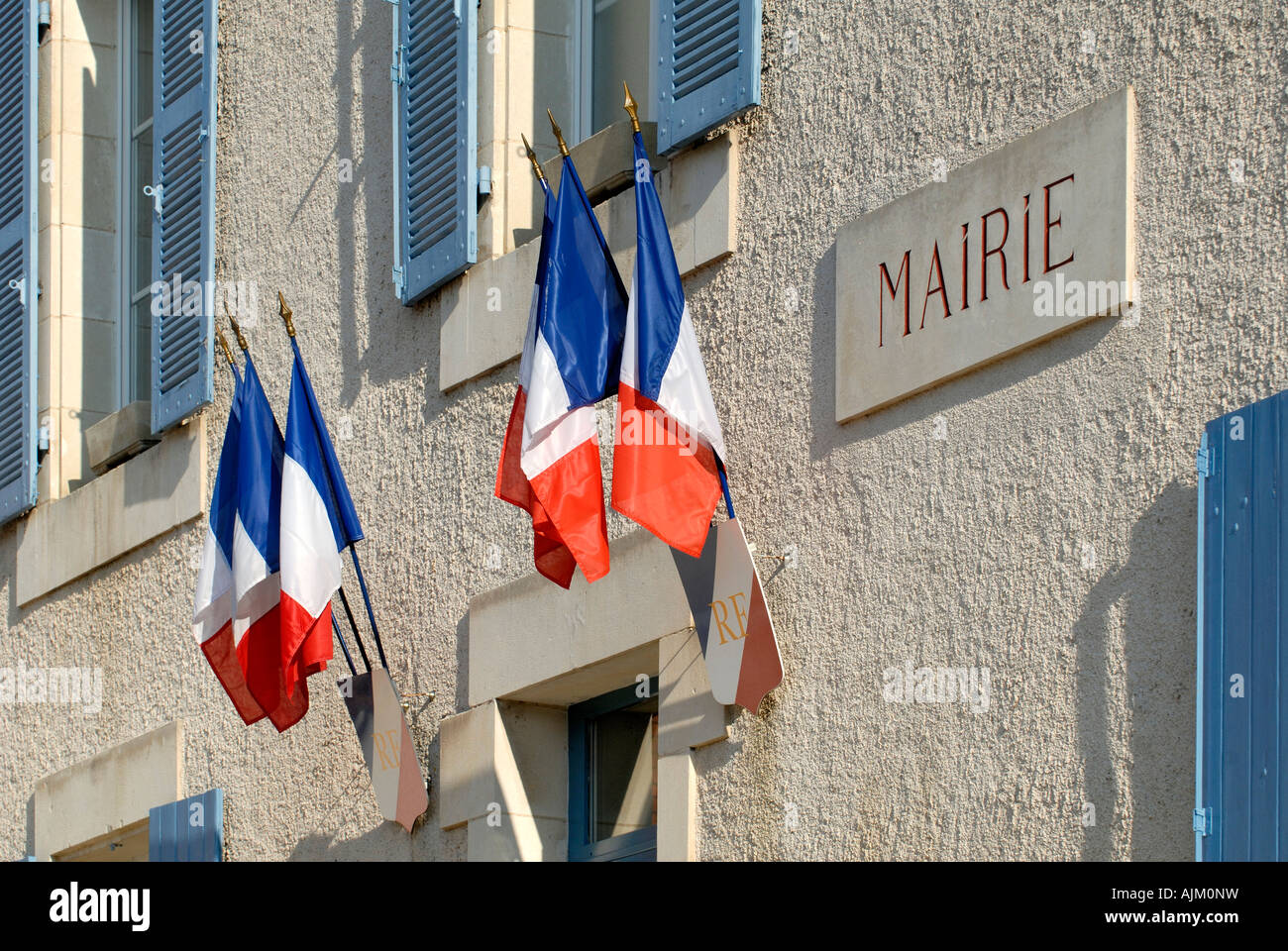 French Tricolor flags on Mairie (town hall), Saulgé, Vienne, France ...