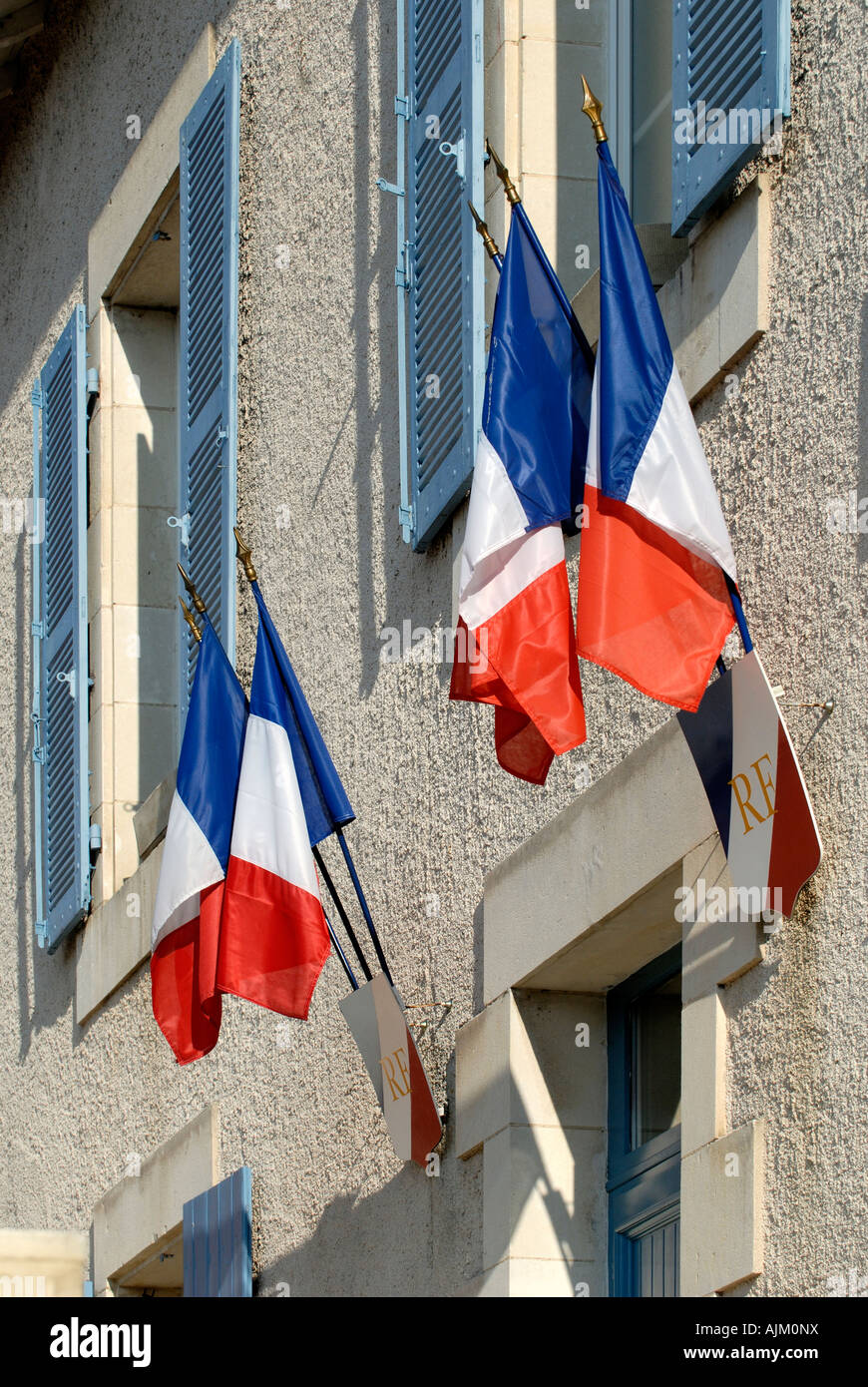 French Tricolor flags on Mairie (town hall), Saulgé, Vienne, France ...