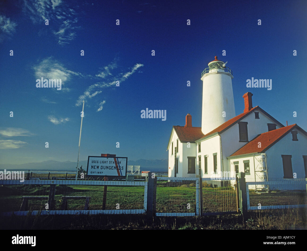 New Dungeness Lighthouse on end of eight mile spit jutting into Strait ...