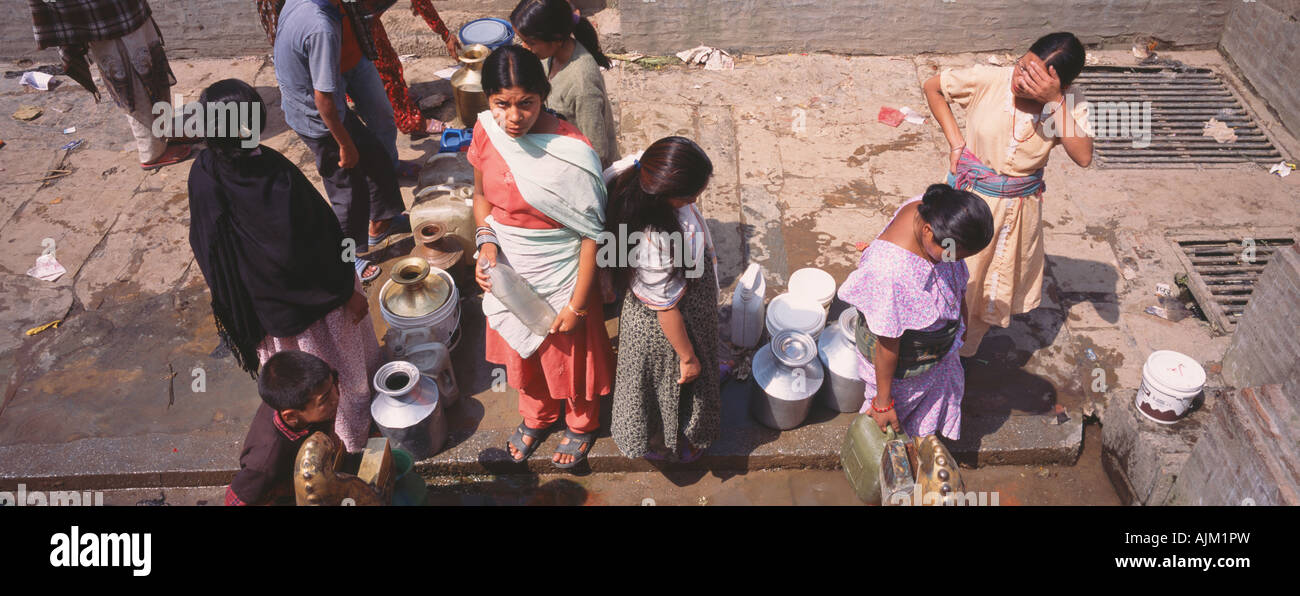 Indian women collecting water in jugs, India Stock Photo - Alamy