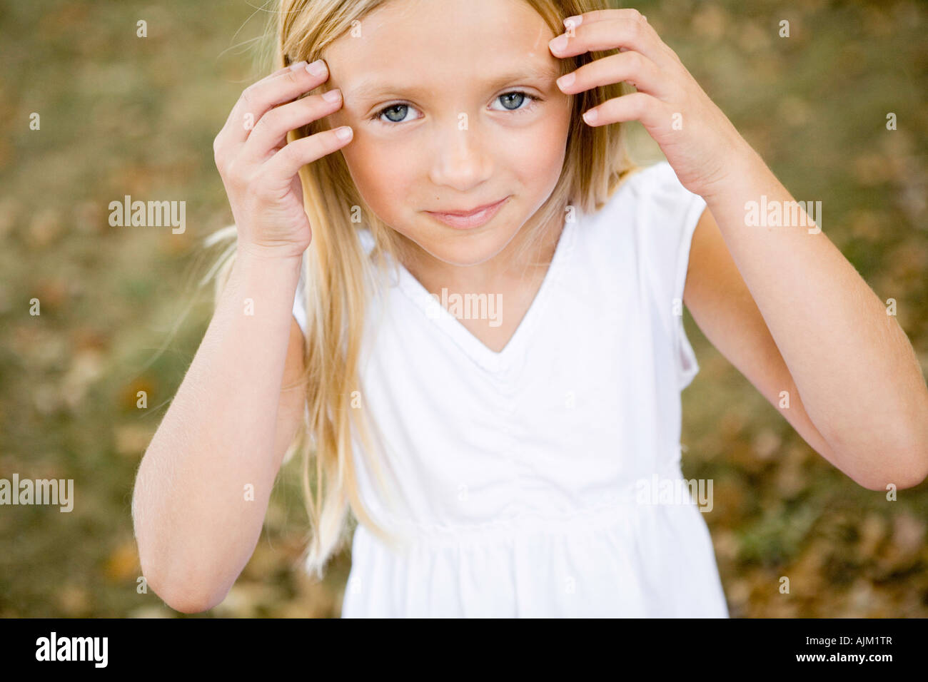 Putting hair behind ears hi-res stock photography and images - Alamy