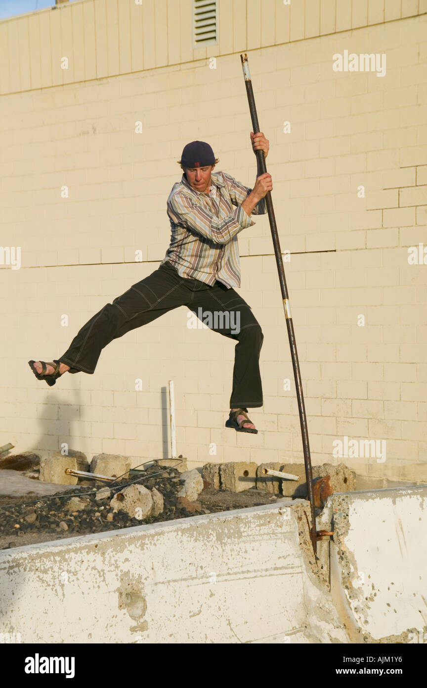 A man spinning around a pole Stock Photo - Alamy