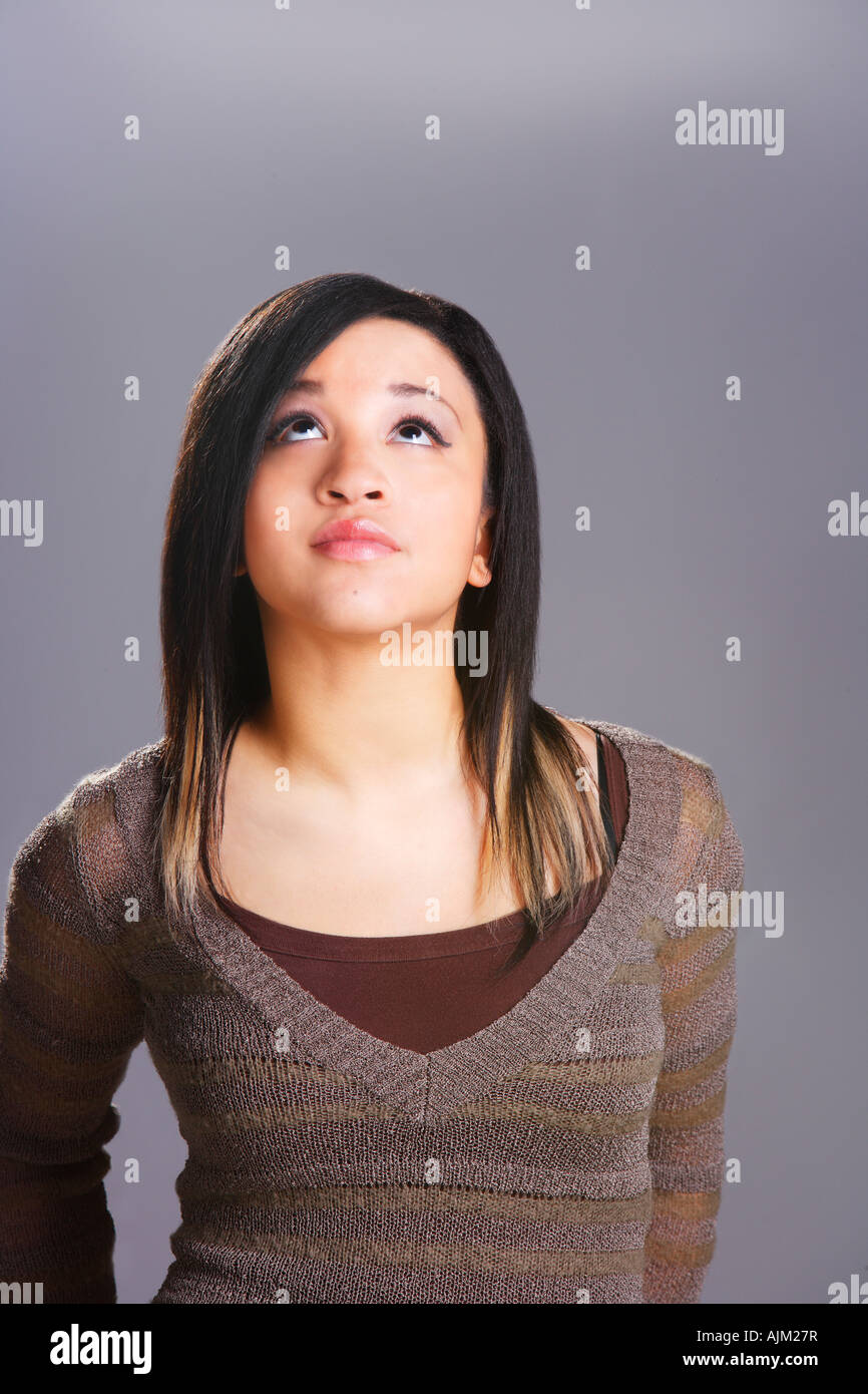Young woman looking upward Stock Photo - Alamy