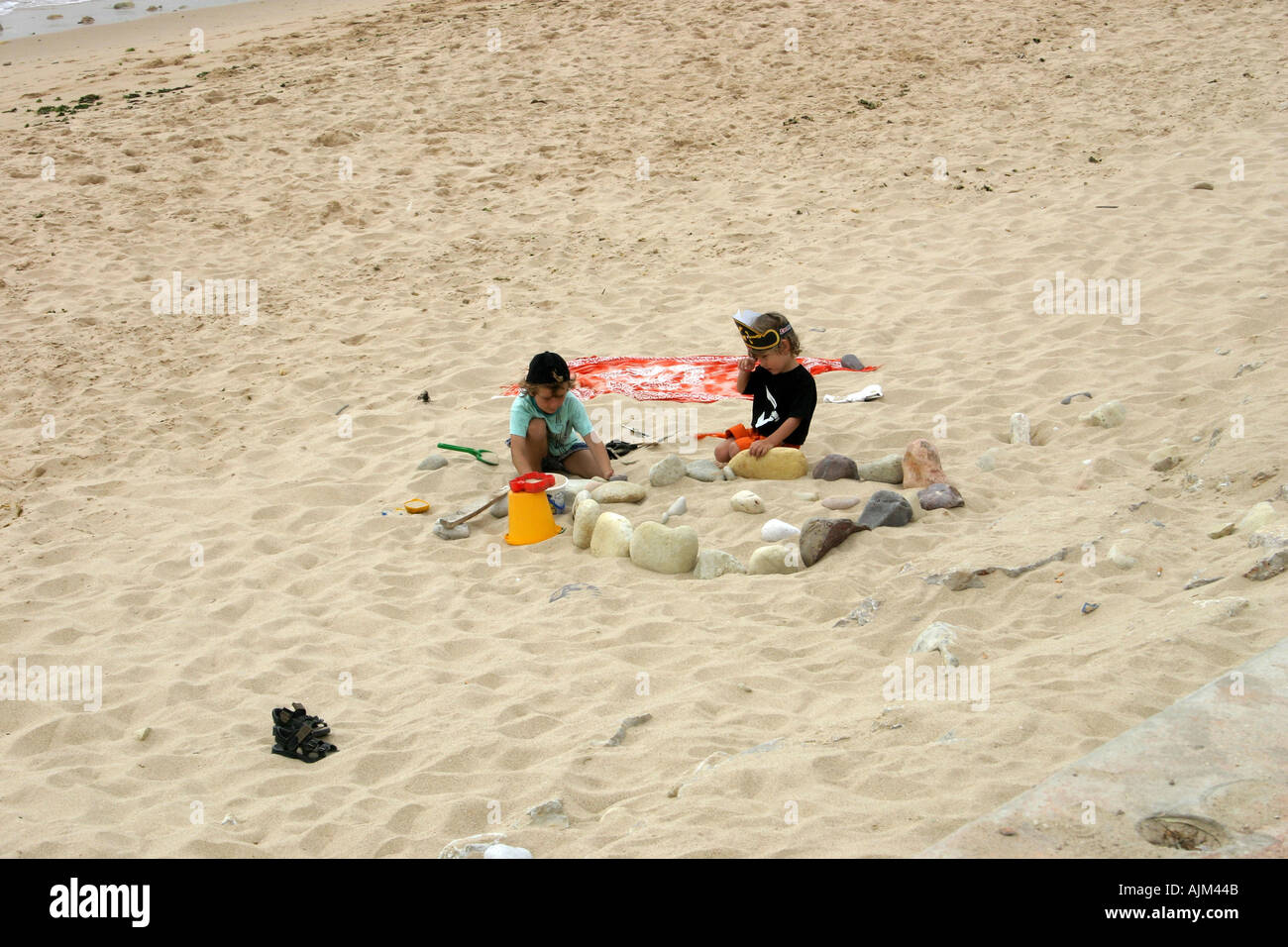 Children at play on the beach Stock Photo - Alamy
