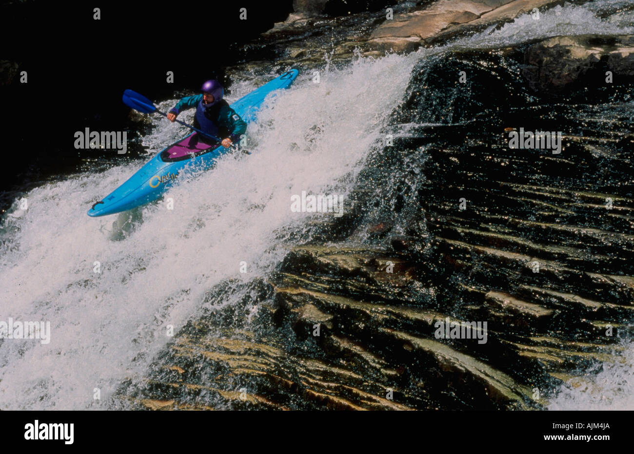 Whitewater kayaker over waterfall Rocky Mountains Utah Stock Photo - Alamy