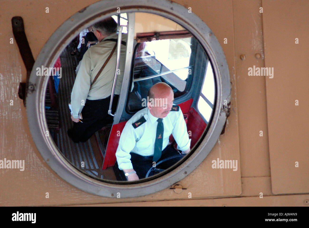 Driver and conductor through a convex rear view mirror on a restored ...