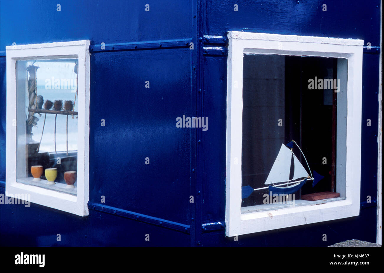 Windows in a beach hut at Lunan Bay in Angus Scotland Stock Photo - Alamy