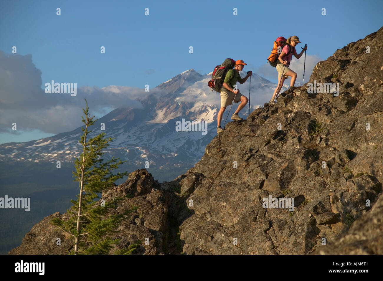 A couple hiking up a mountain ridge near Mount Adams Stock Photo - Alamy