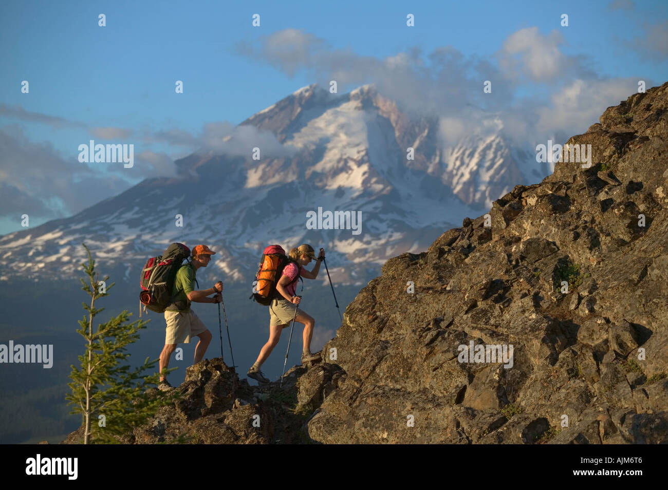 A couple hiking up a mountain ridge near Mount Adams Stock Photo - Alamy