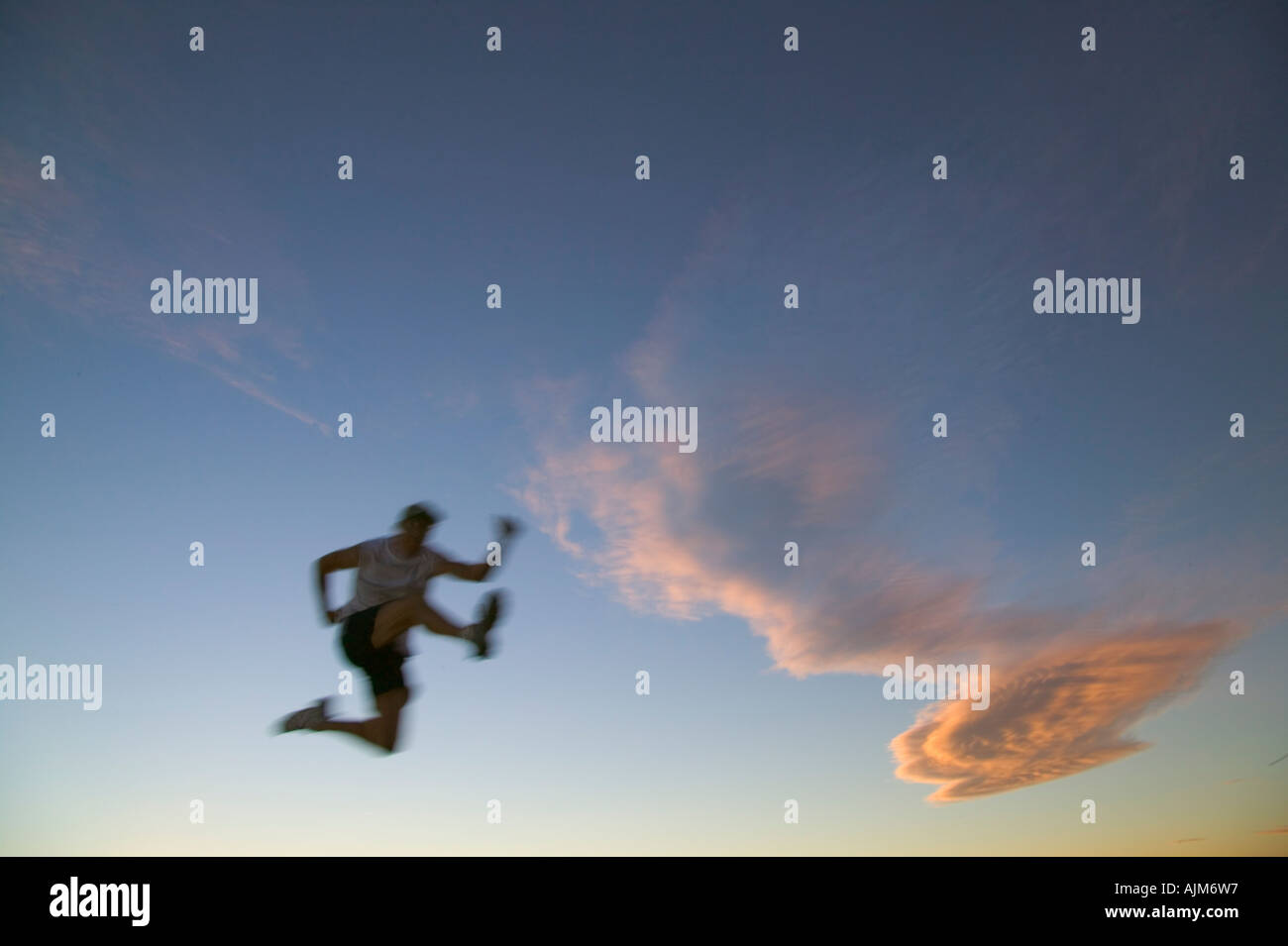 A man running and jumping near Truckee CA Stock Photo - Alamy