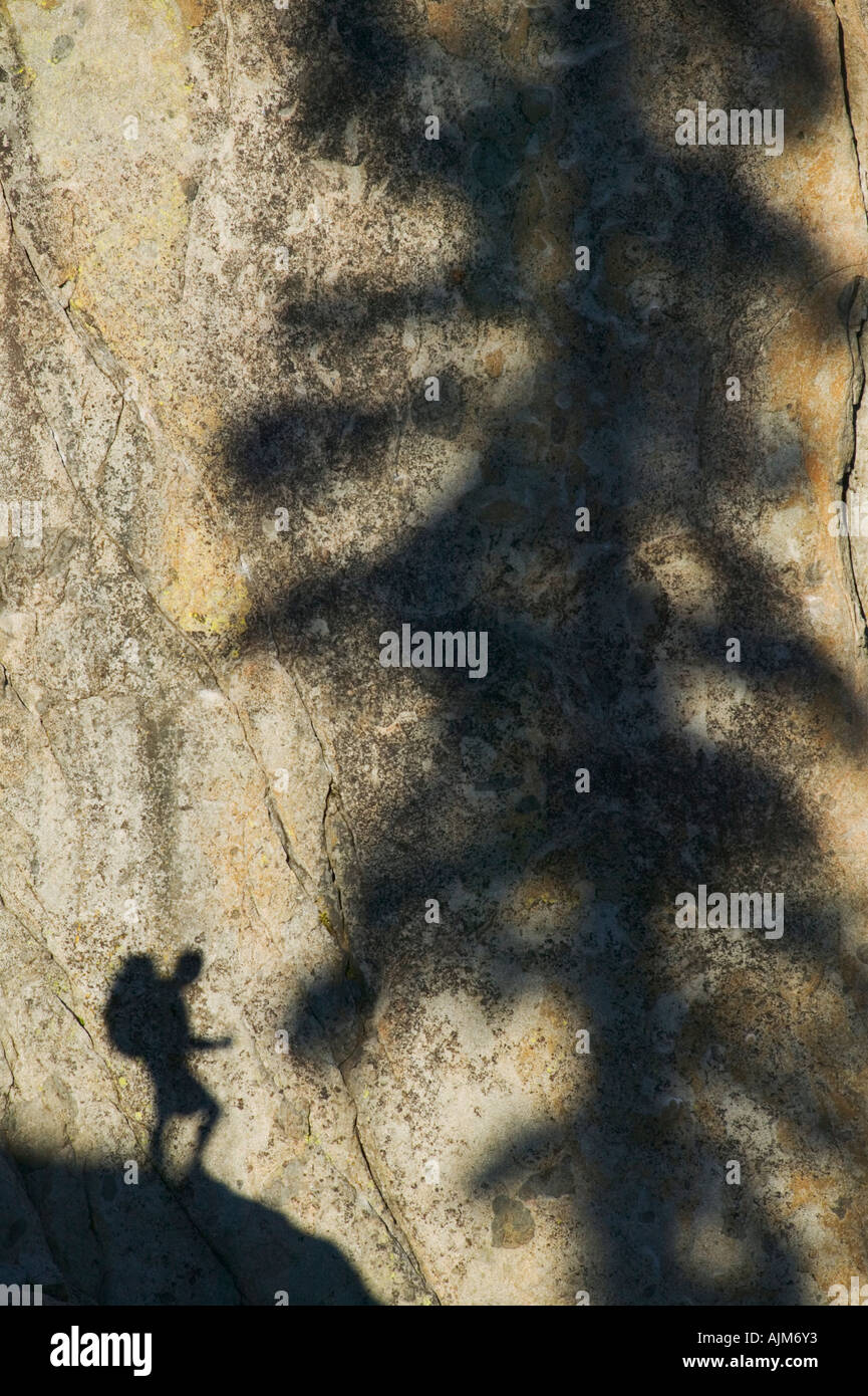 A man hiking next to his shadow Stock Photo - Alamy