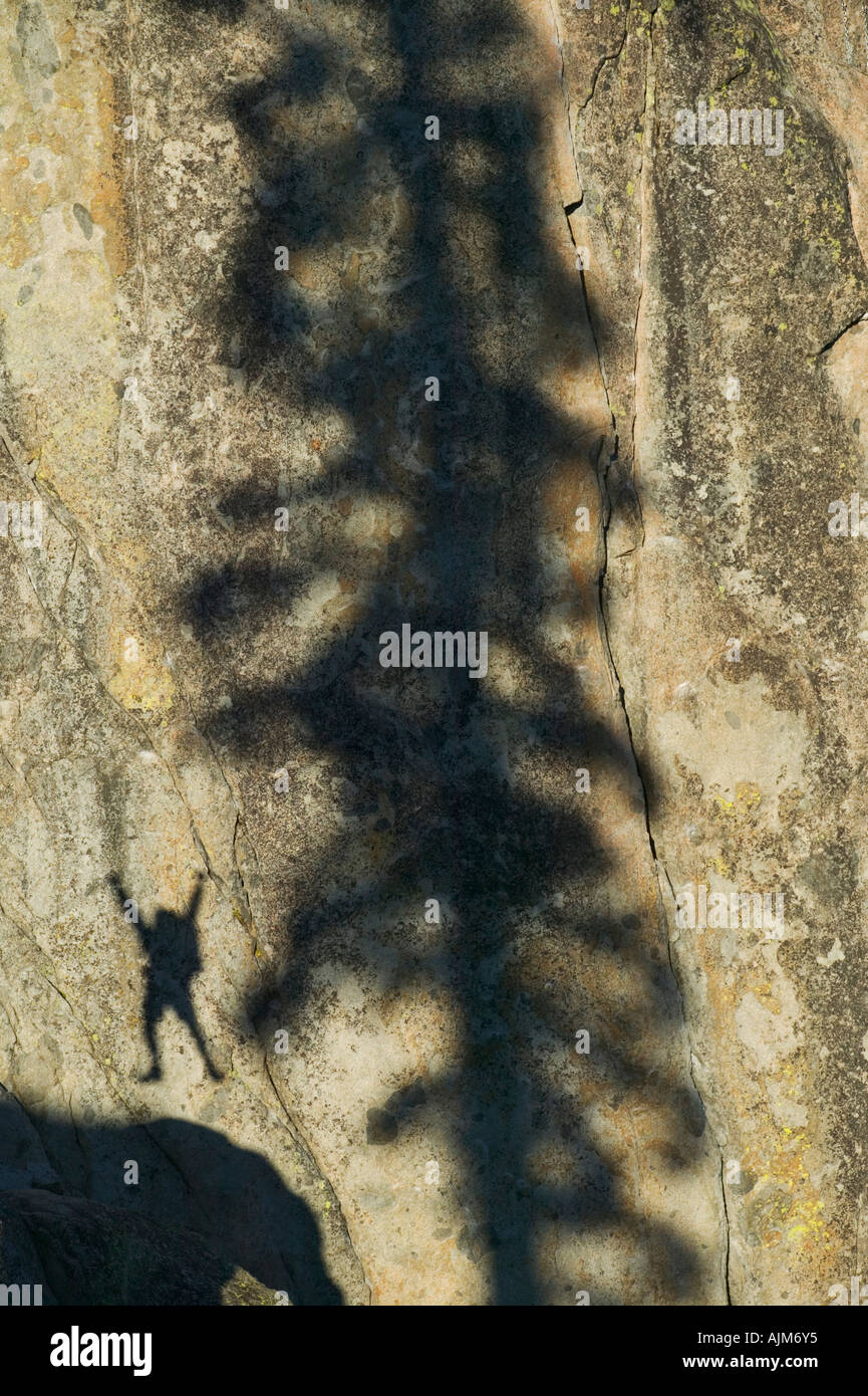 A man playing with his shadow while hiking Stock Photo - Alamy