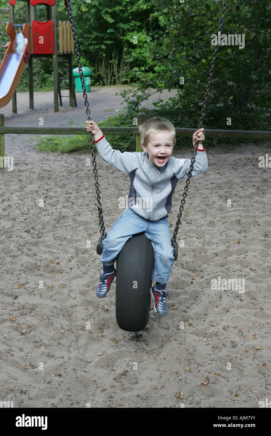 Boy on a tyre hi-res stock photography and images - Alamy