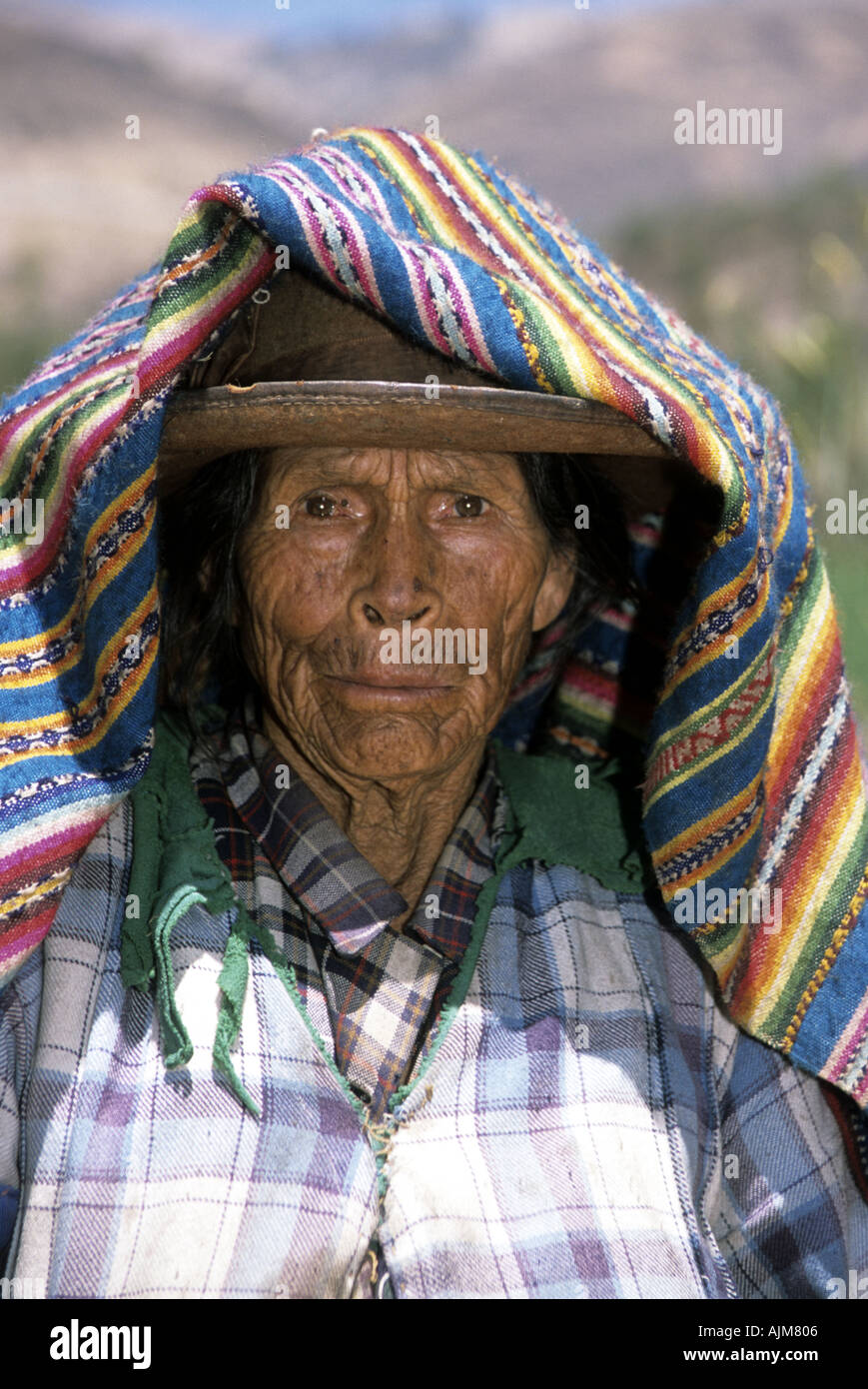 Old female beggar with hat and colourful Peruvian cloth. Peru, South ...