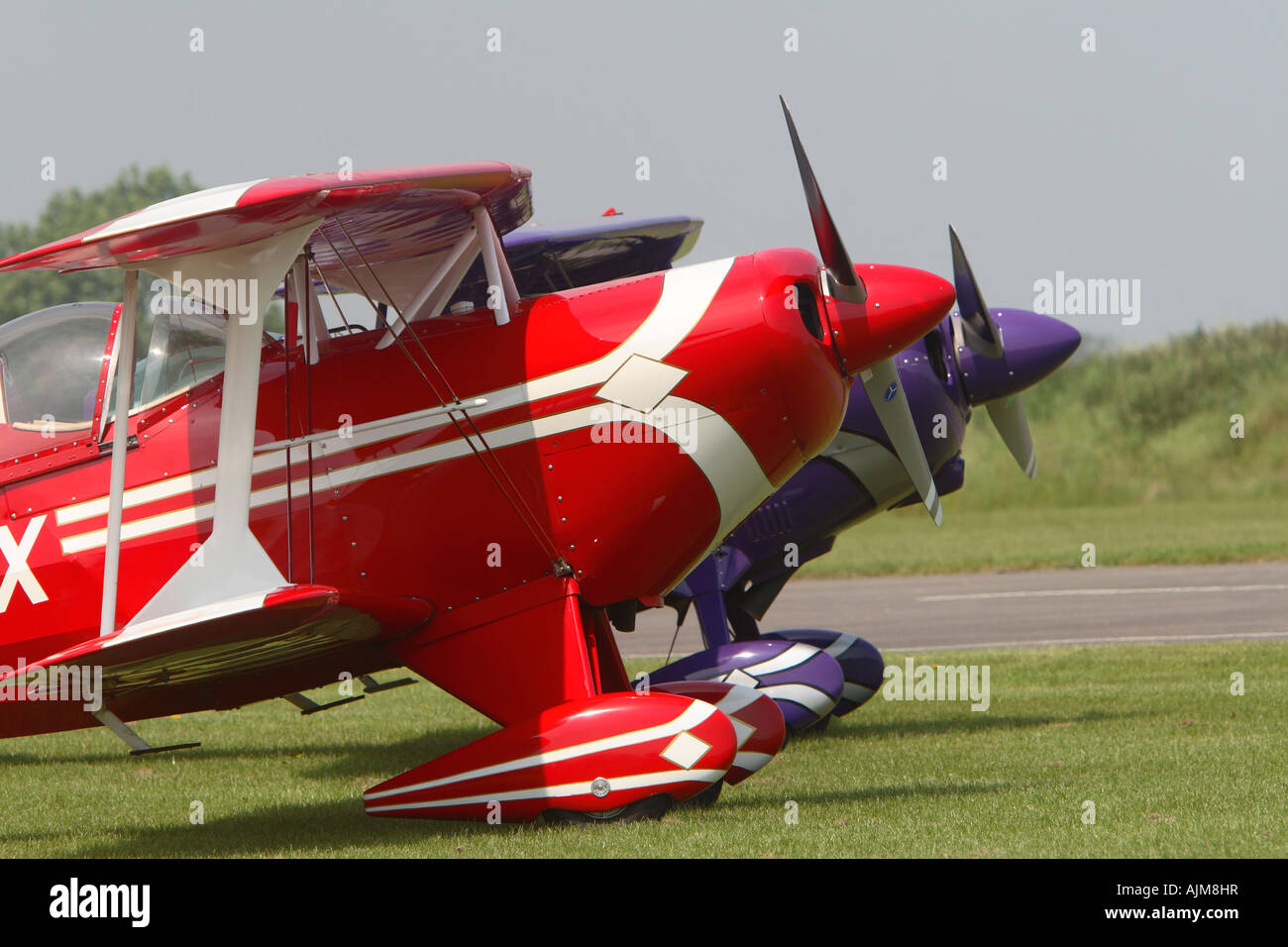 Purple and red Pitts Special aerobatic aeroplanes lined up Stock Photo ...