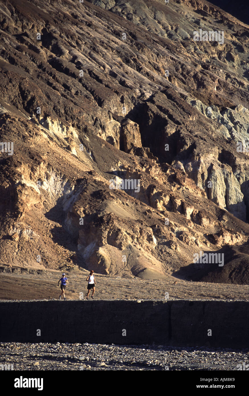 Two women running on a desert trail near Death Valley CA Stock Photo ...